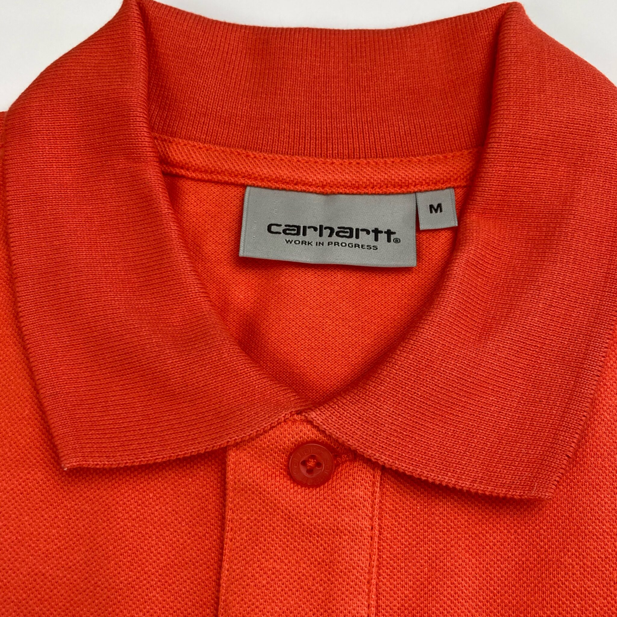 Carhartt WIP Coral Red Script Polo Shirt | The Rainy Days